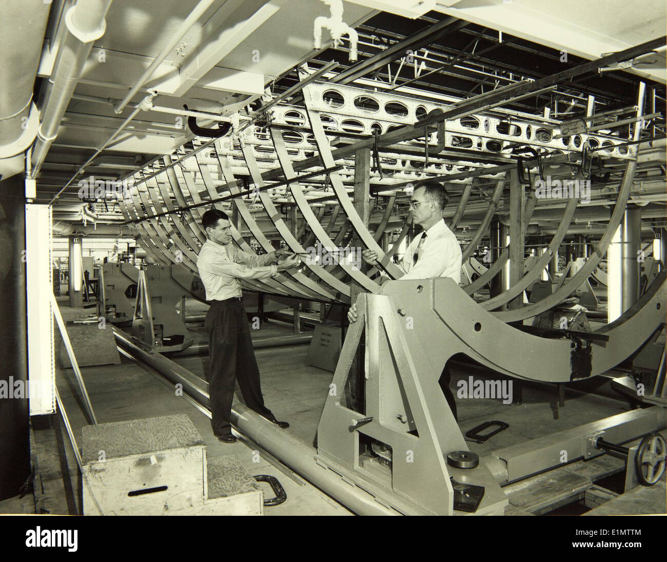 This image shows the assembly process of the Convair 880, a commercial ...