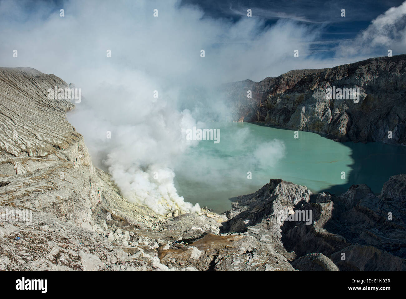 view of the smoking Kawah Ijen volcanic crater and lake, Java ...