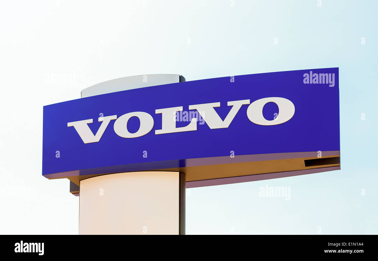 Volvo dealership sign against blue sky. Volvo is a Swedish ...