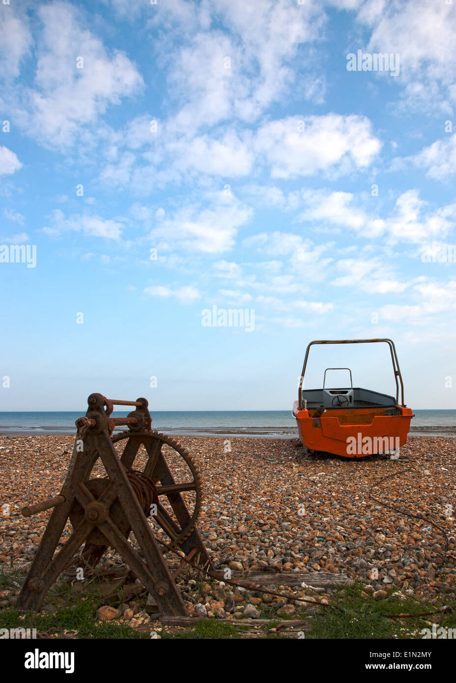 Fishing boat and an old rusty winch on the beach at Ferring, West ...