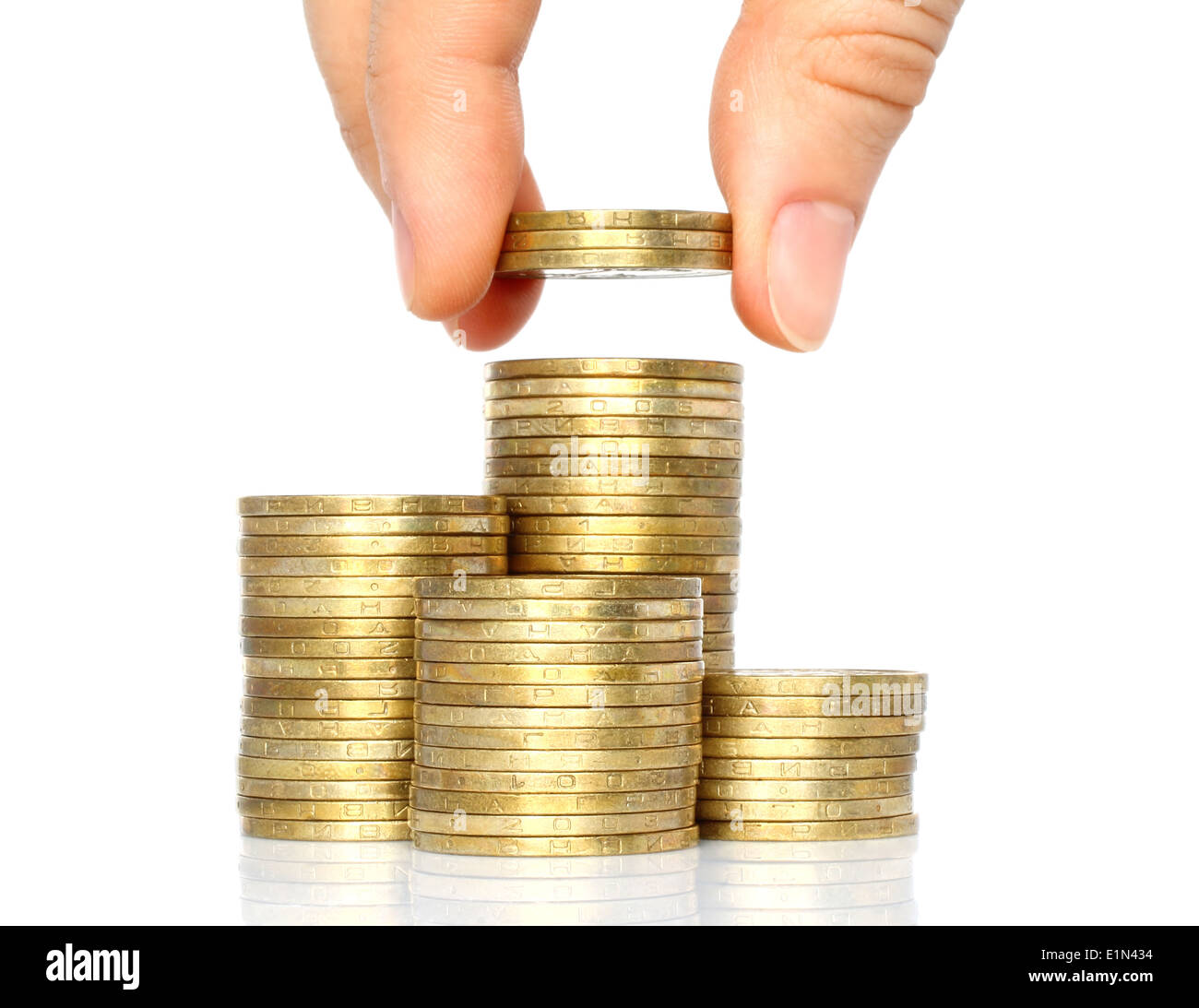 Hand put coins to stack of coins on white background Stock Photo - Alamy