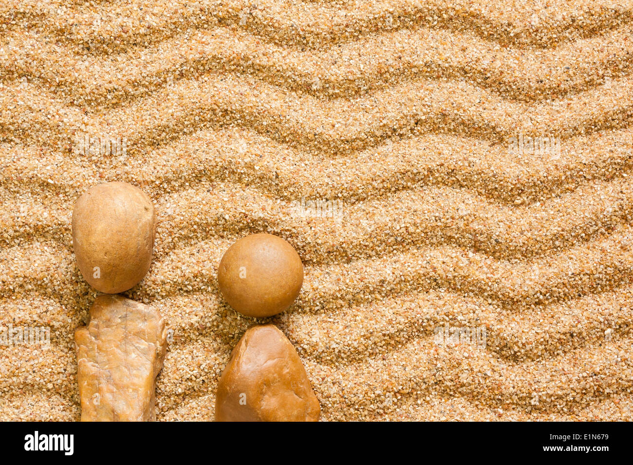 A wave patterned sand background with a silhouette set using beach ...