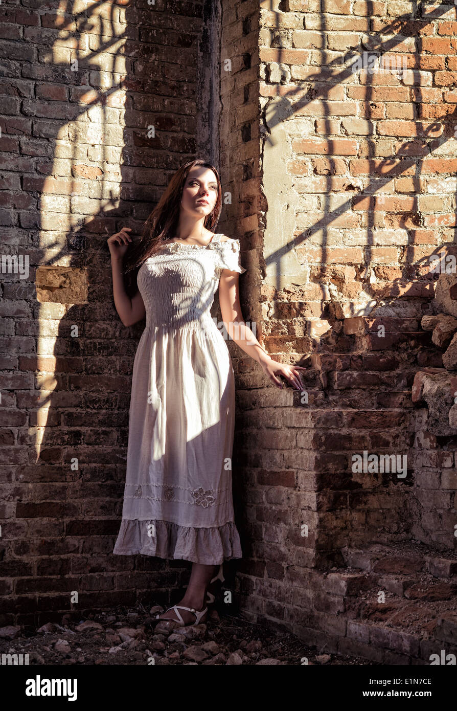 Dramatic portrait of a beautiful young girl in white dress Stock Photo ...