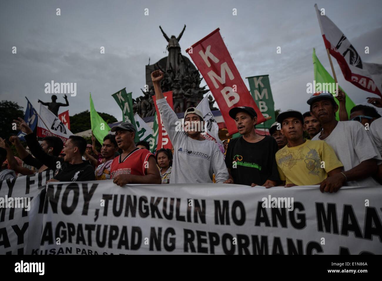 Quezon, Philippines. 7th June, 2014. Farmers shout slogans during a ...
