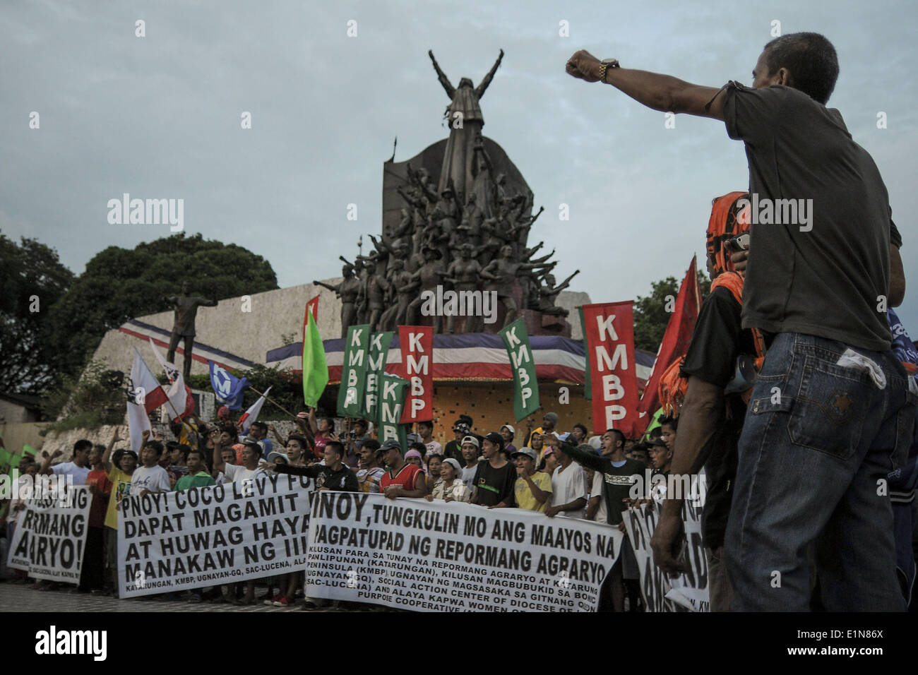 Quezon, Philippines. 7th June, 2014. Farmers shout slogans during a ...