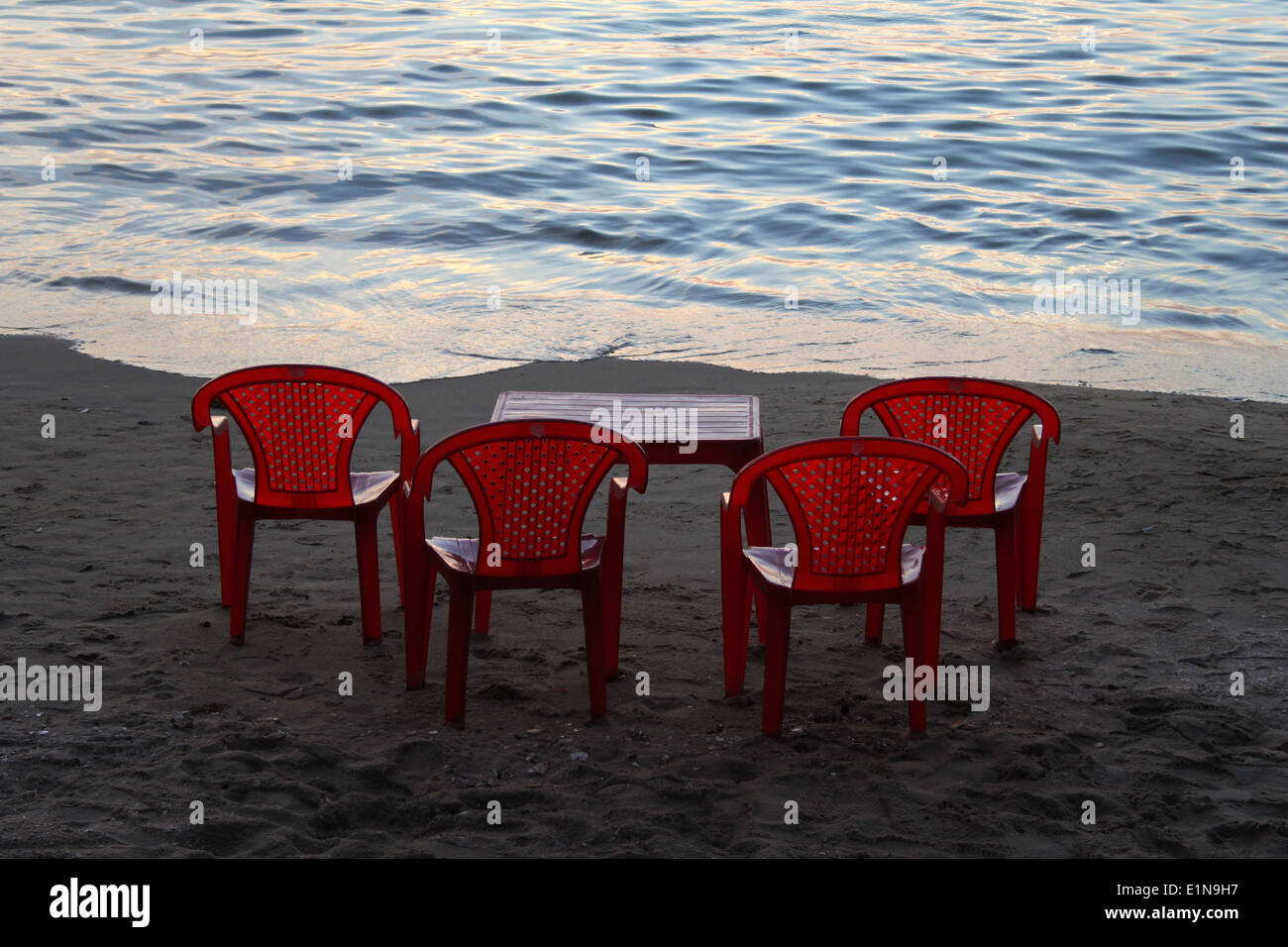 Empty plastic chairs facing the sea Stock Photo - Alamy