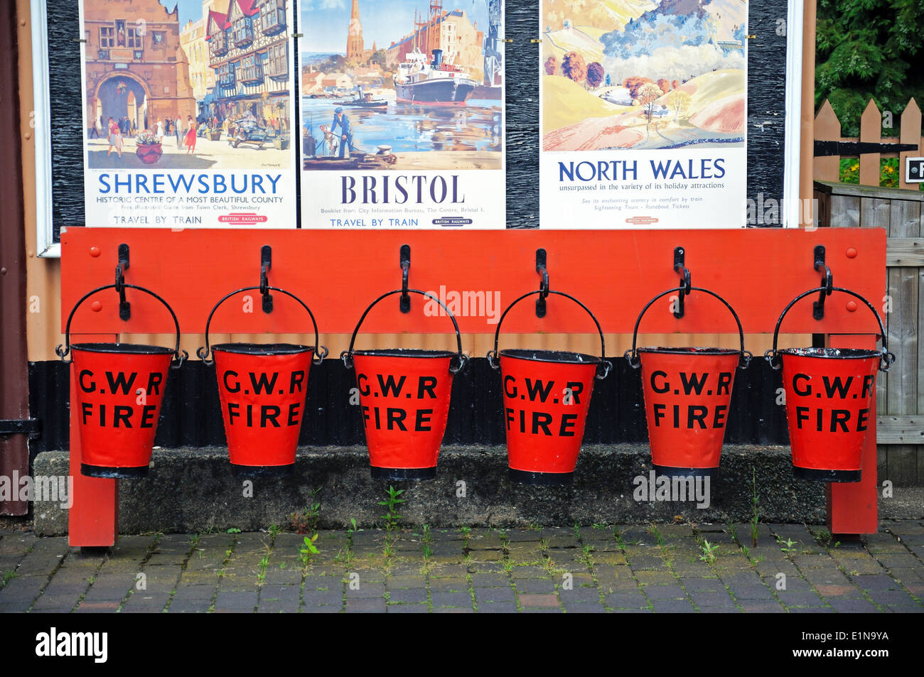 Row of red Victorian Fire buckets on the railway platform, Hampton ...