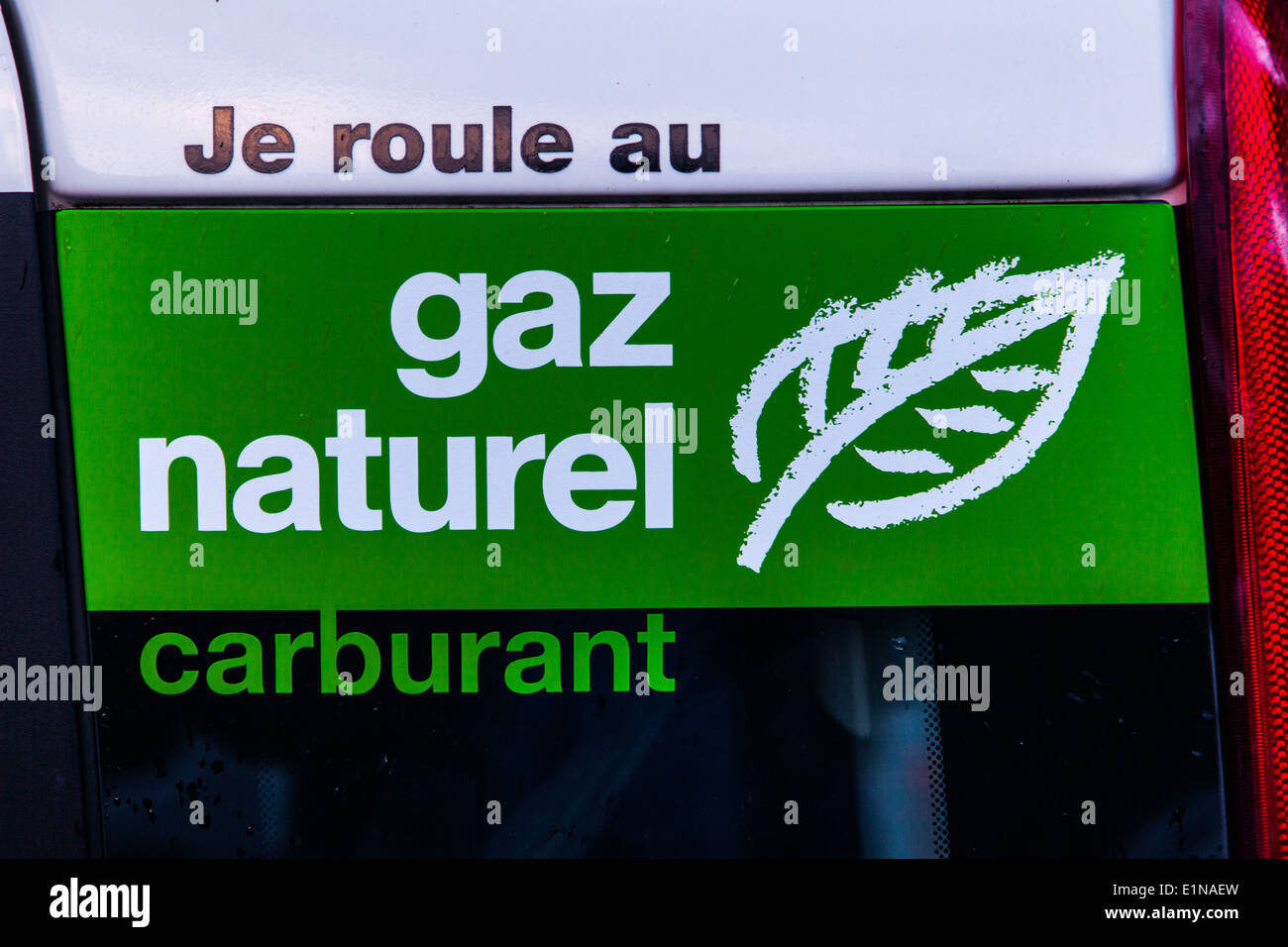 French language sign on a car telling it is powered by natural gas ...
