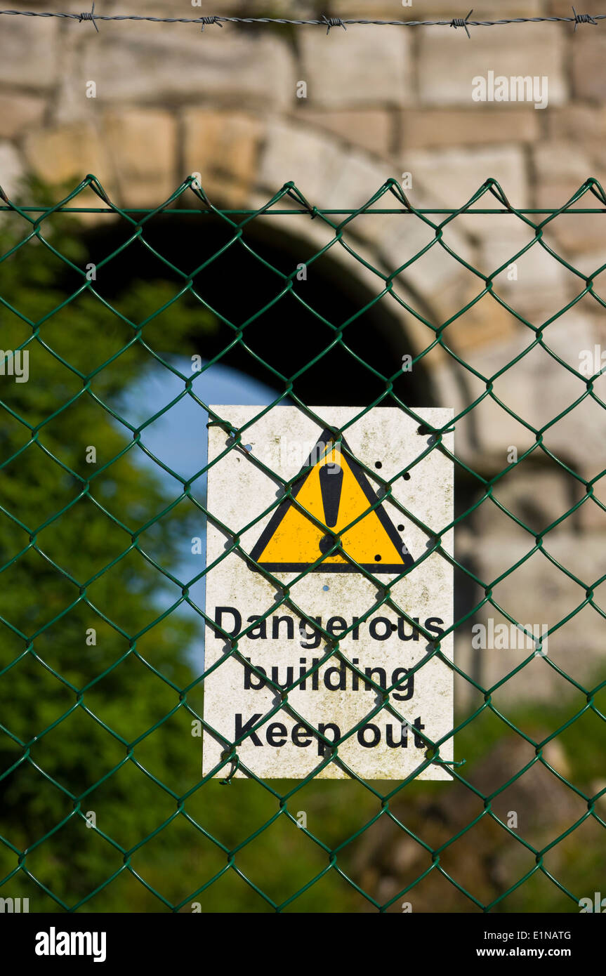 Fence around historic ruin Dangerous building keep out sign Stock Photo ...