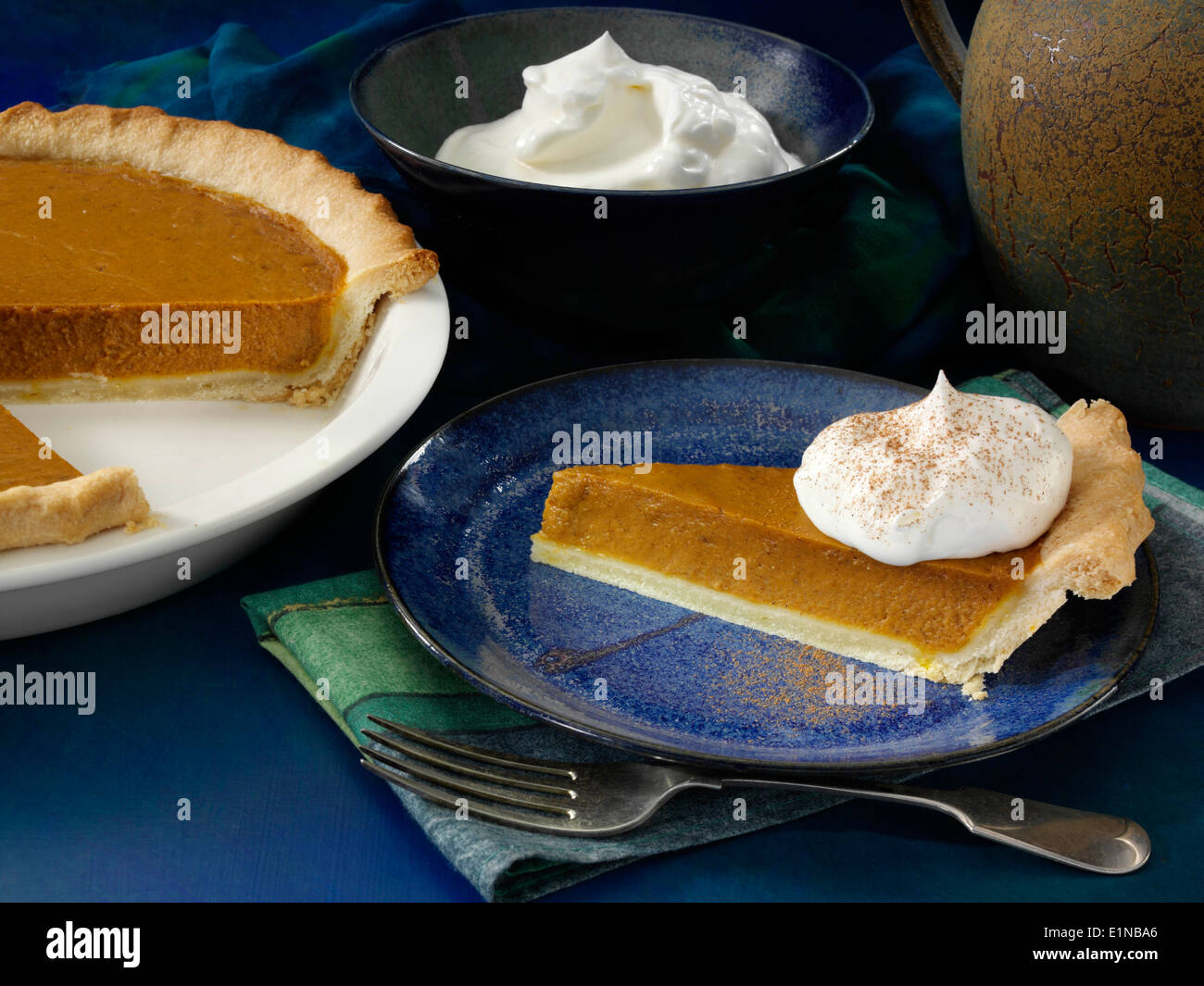 Whole pumpkin pie and slice Stock Photo - Alamy