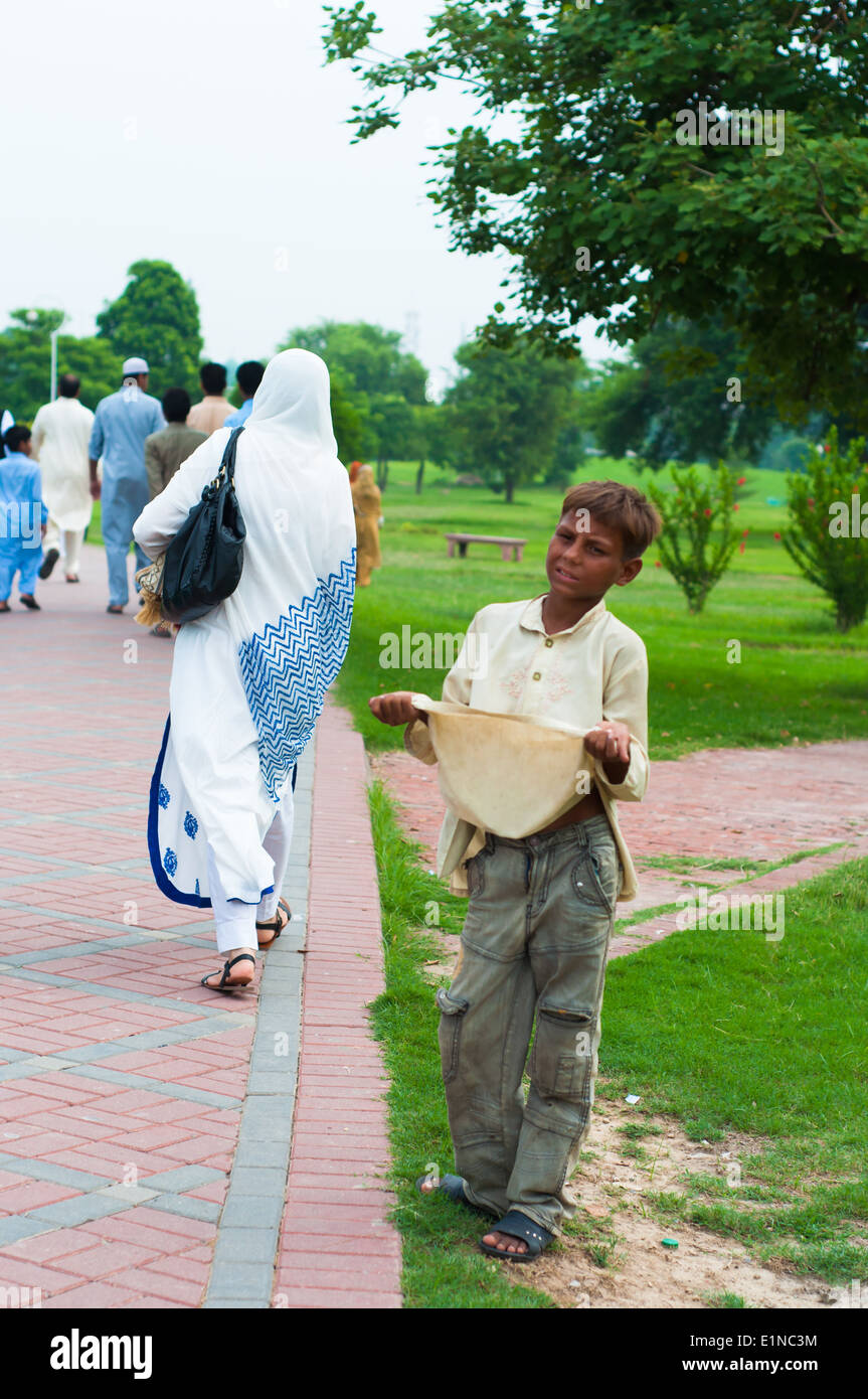 Child beggar in Lahore Pakistan, depiction of poverty, rich and poor ...