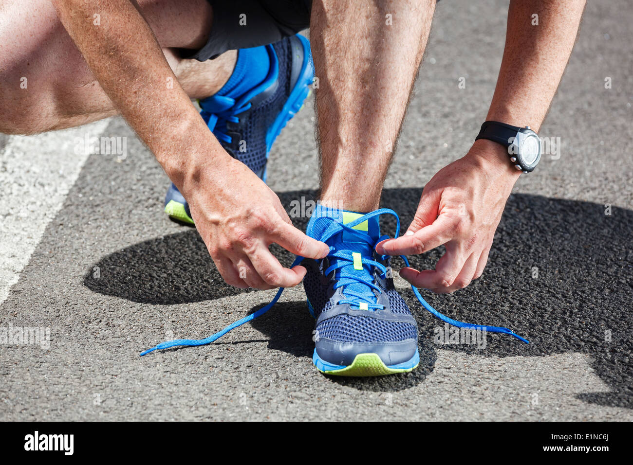 Runner trying running shoes getting ready for run Stock Photo - Alamy