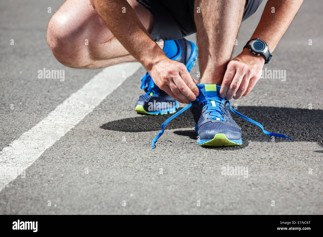 Runner trying running shoes getting ready for run Stock Photo - Alamy