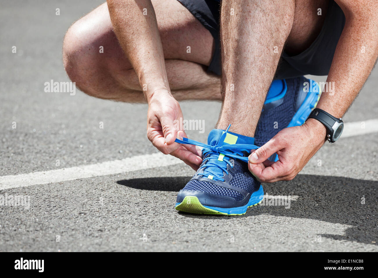 Runner trying running shoes getting ready for run Stock Photo - Alamy
