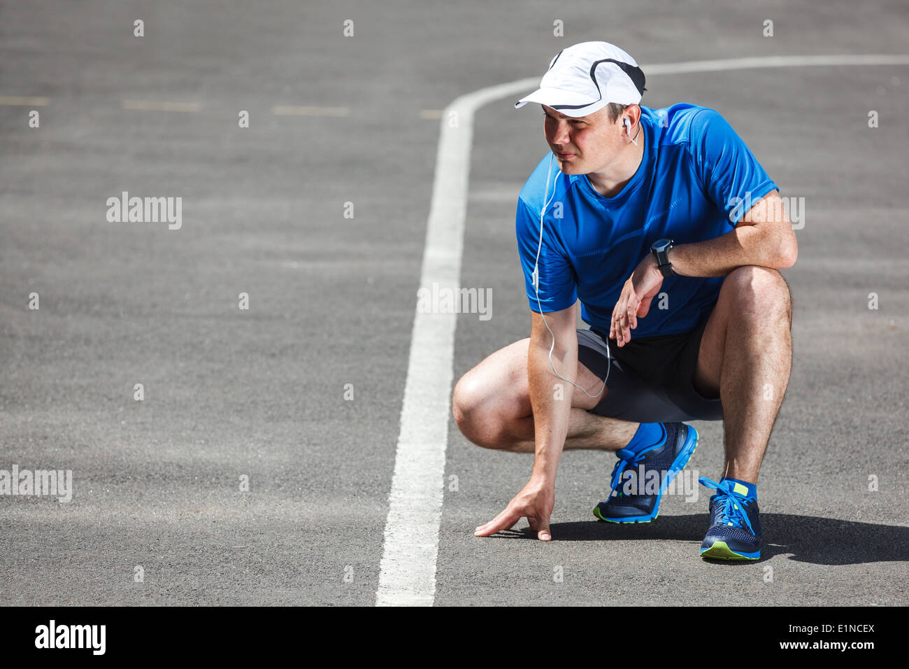 Male runner earphones hi-res stock photography and images - Alamy