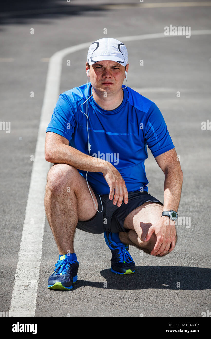 Runner at the start hi-res stock photography and images - Alamy