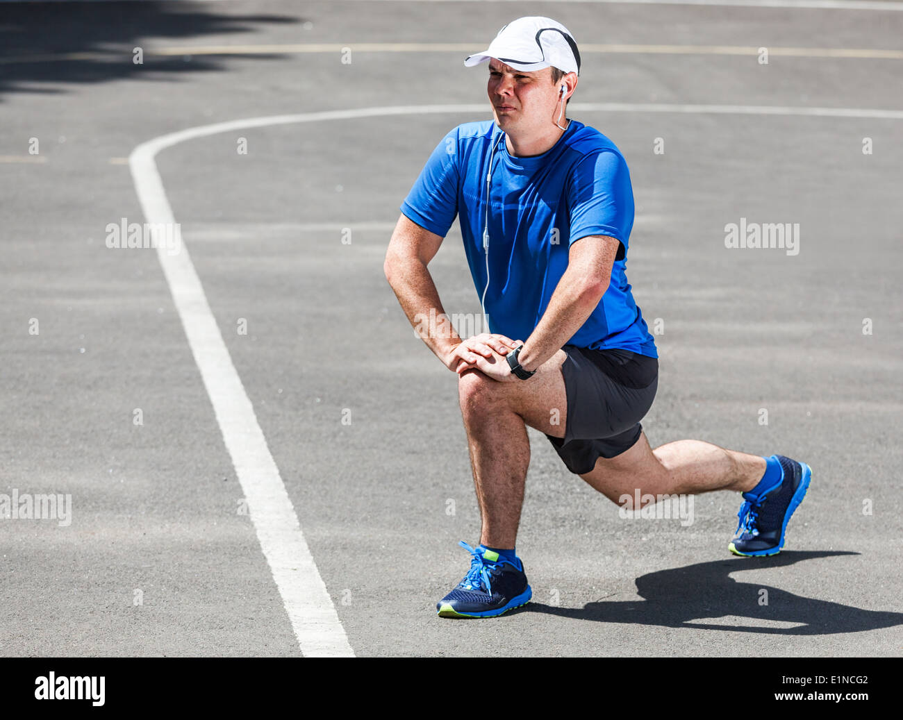 Male runner stretching hi-res stock photography and images - Alamy