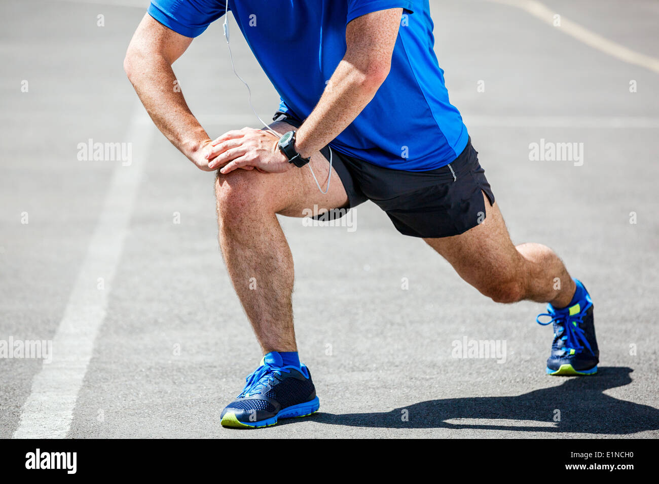 Male runner stretching before workout Stock Photo - Alamy