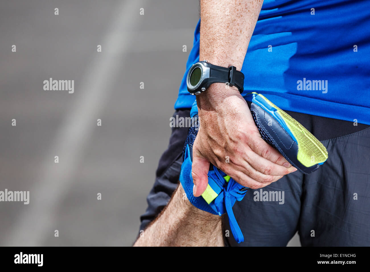 Male runner stretching before workout Stock Photo - Alamy