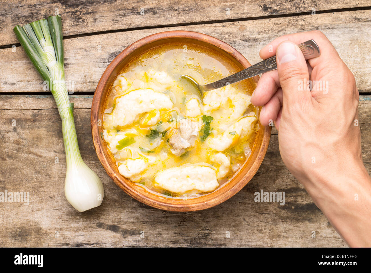 National ukrainian food. Soup with galushky. Eating of dumpling. Top ...