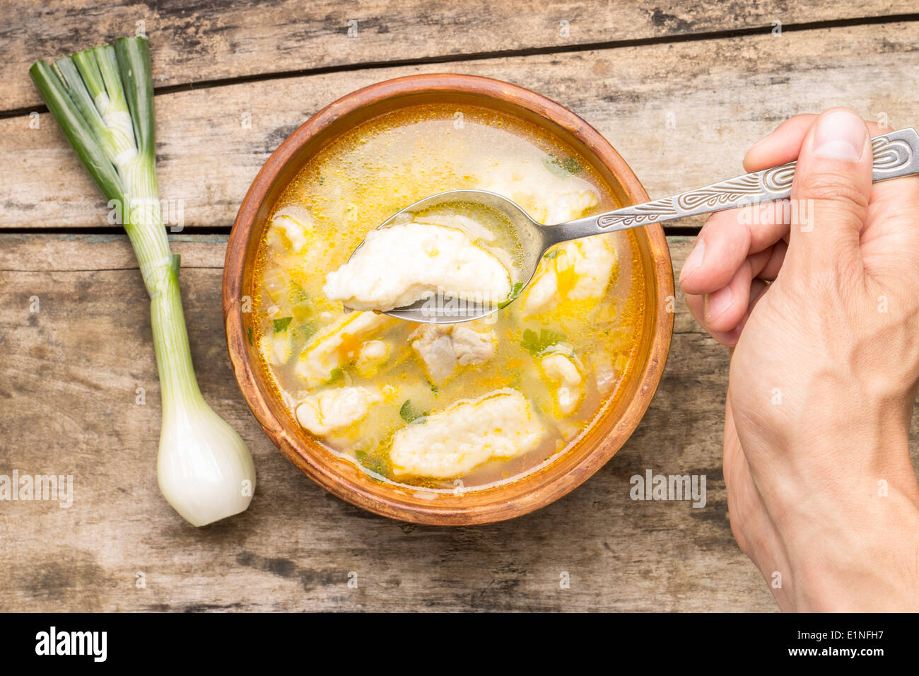 National ukrainian food. Soup with galushky. Eating of dumpling. Top ...