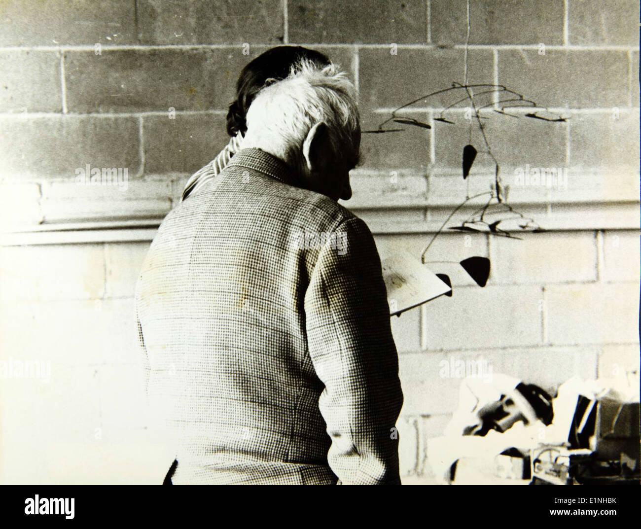 This photo shows Alexander Calder with artist Paul Matisse, holding a ...