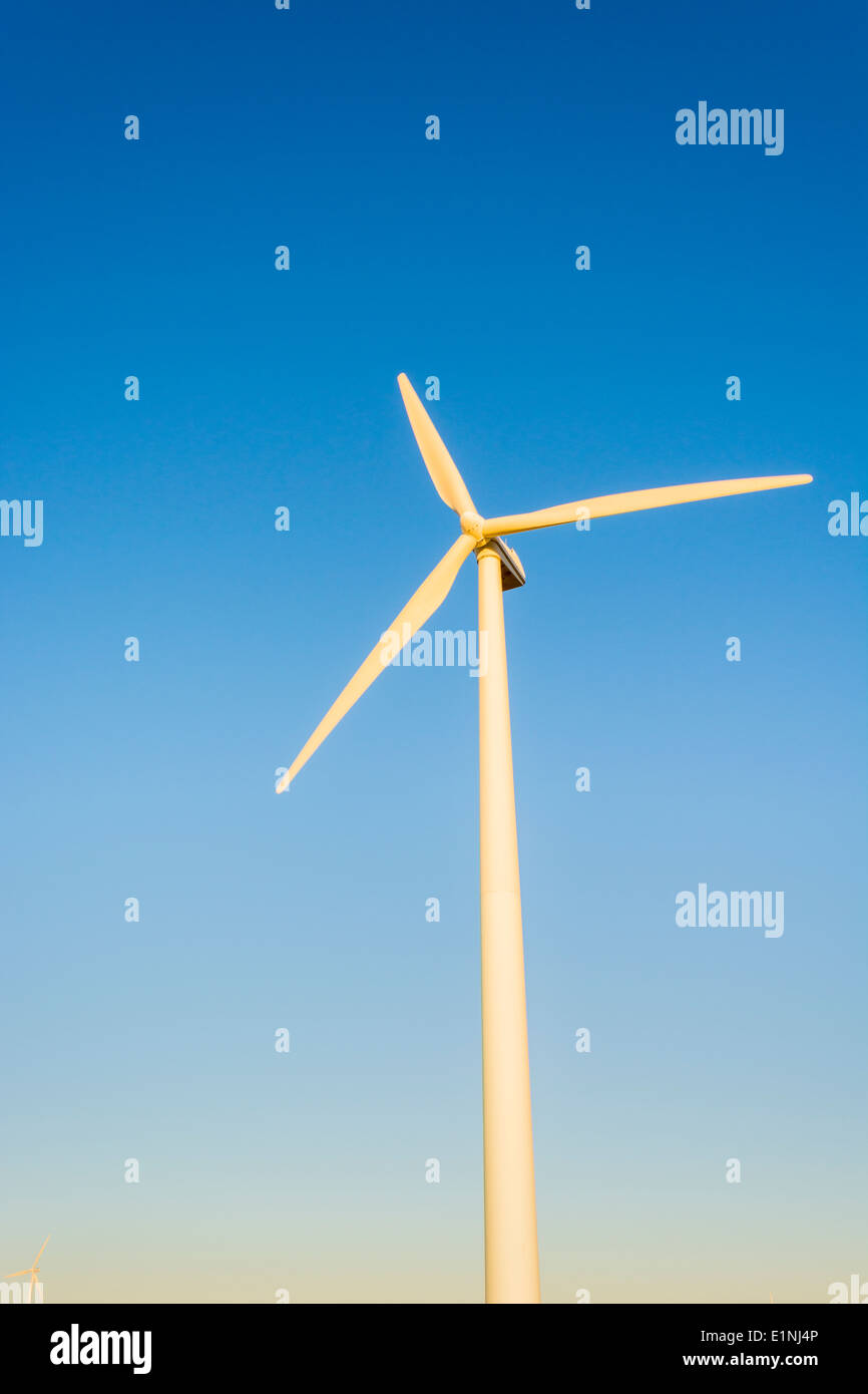 Wind turbine with a blue sky in the background Stock Photo - Alamy