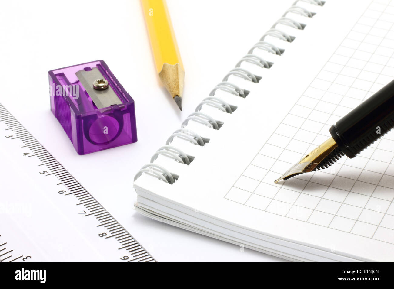 Notepad with stationary objects on a white background Stock Photo - Alamy