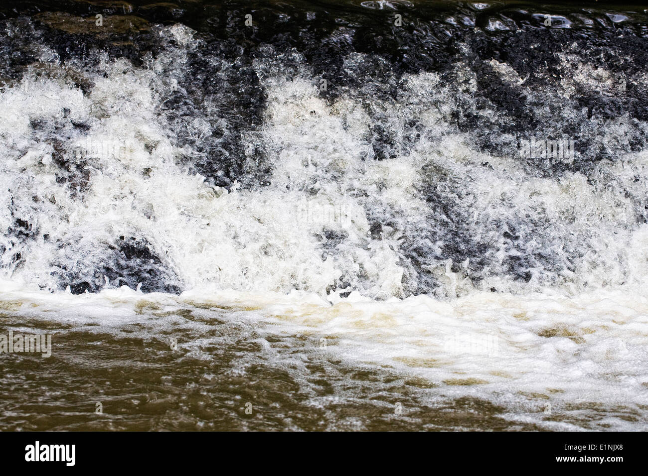 River tumbling over a weir Stock Photo - Alamy