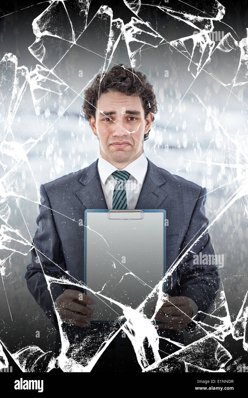 sad business man behind broken glass holding blank notes for copy space ...