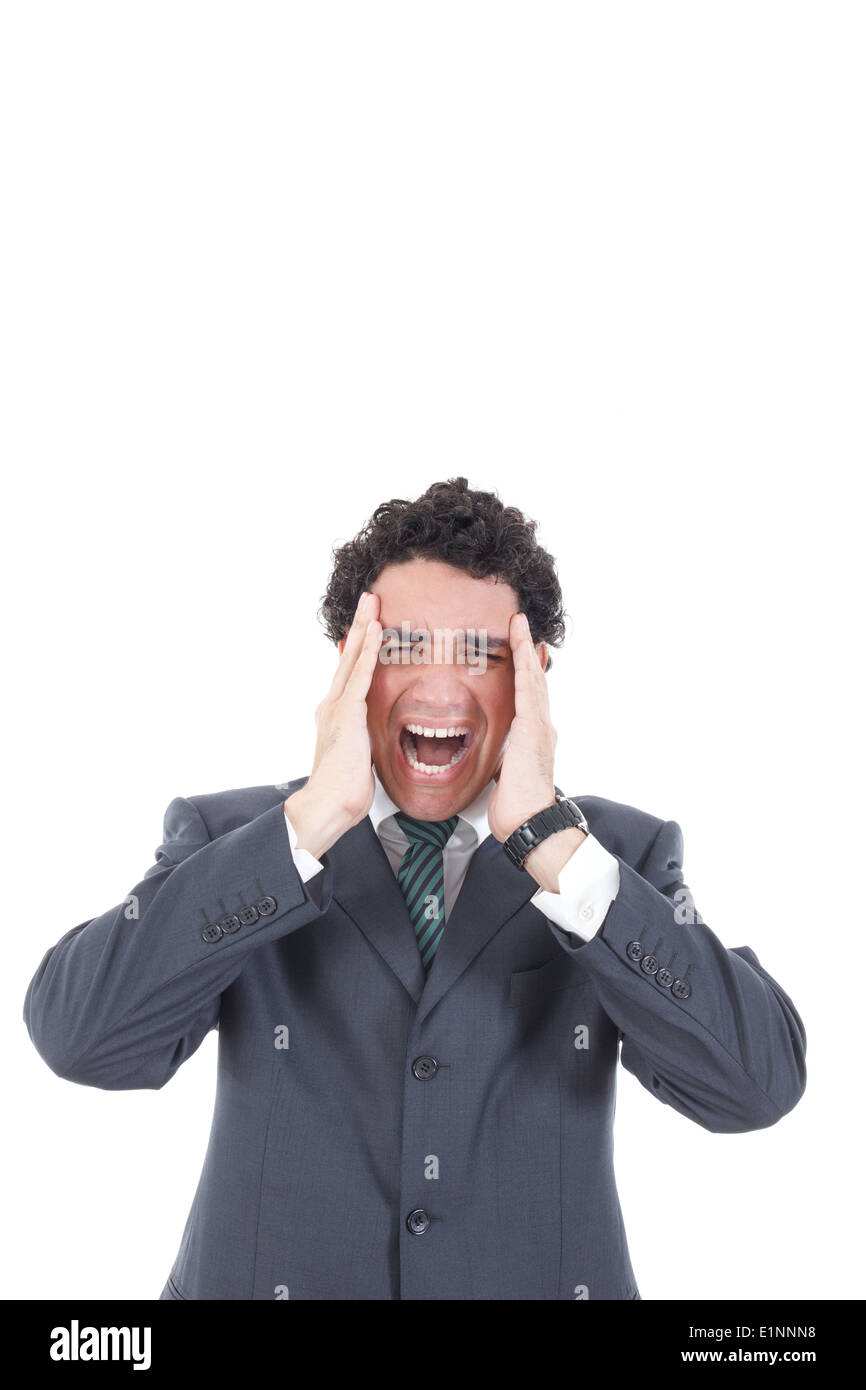 Portrait of stressed businessman screaming in pain and having headache ...