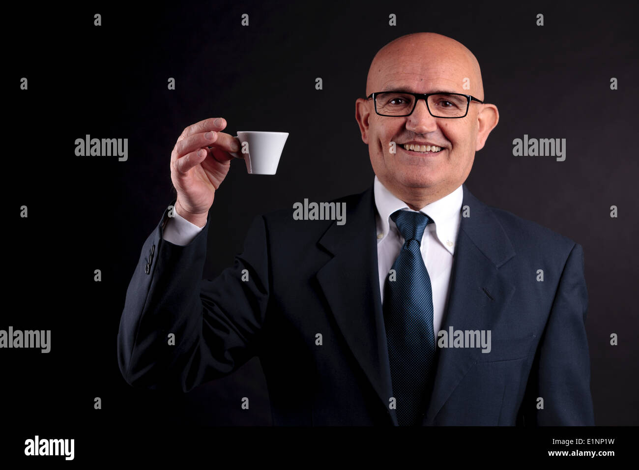 Happy mature bald businessman relaxing hi-res stock photography and ...