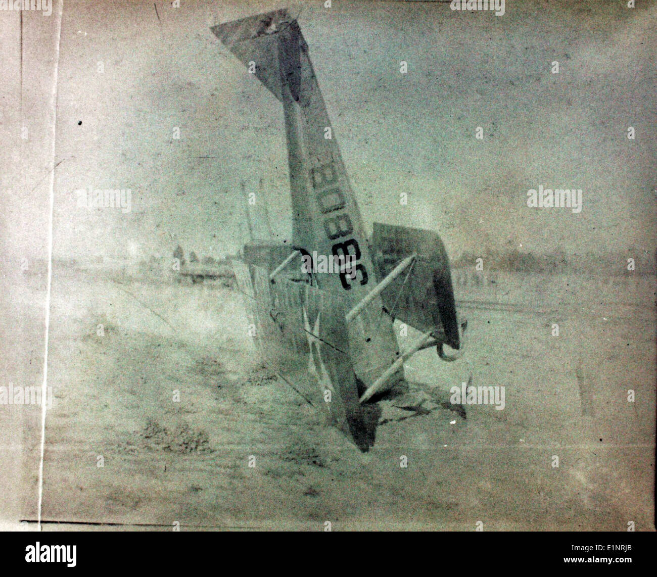This image captures the aftermath of an aircraft accident between 1920 ...