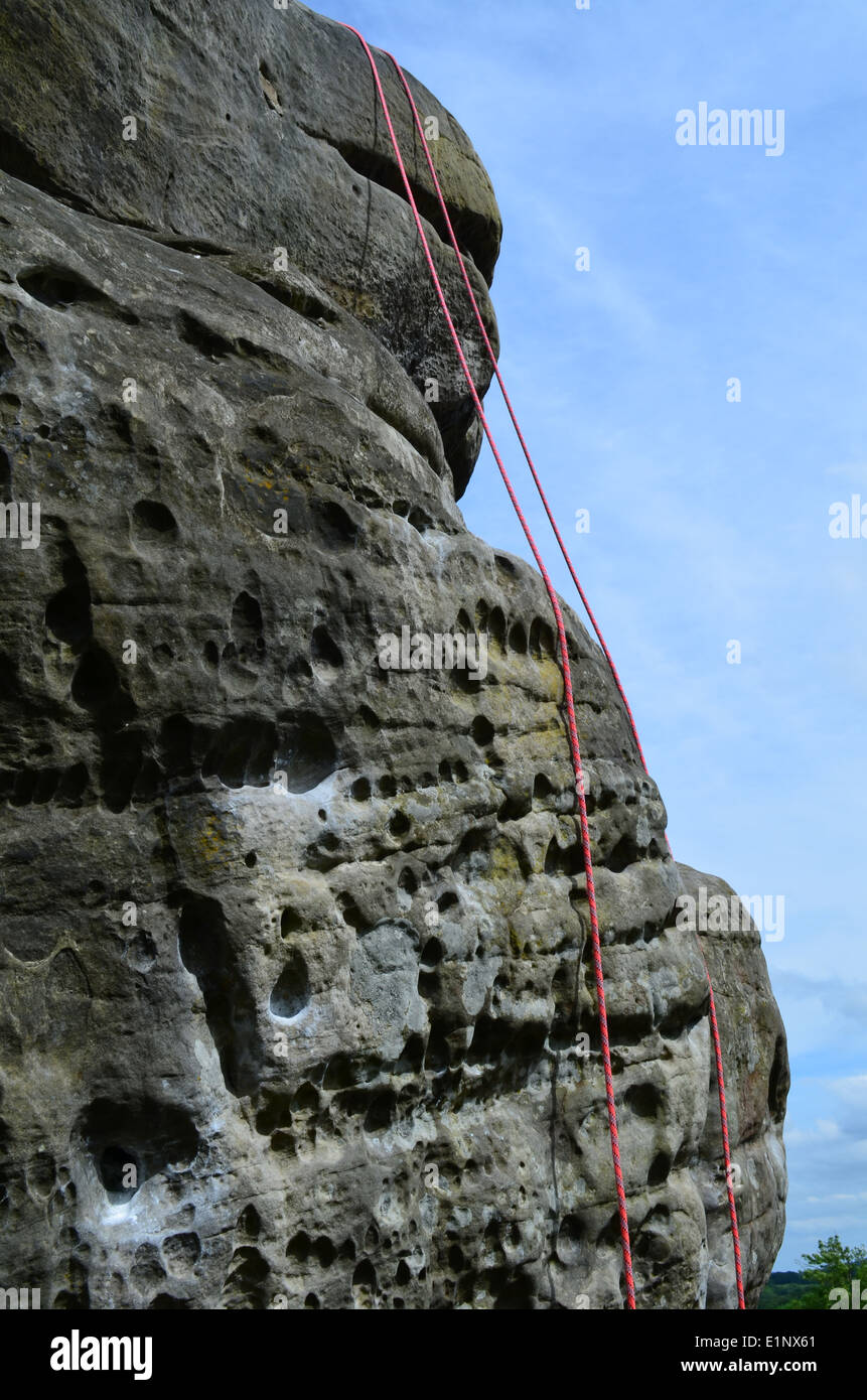Rock climbing ropes on rock face Stock Photo - Alamy