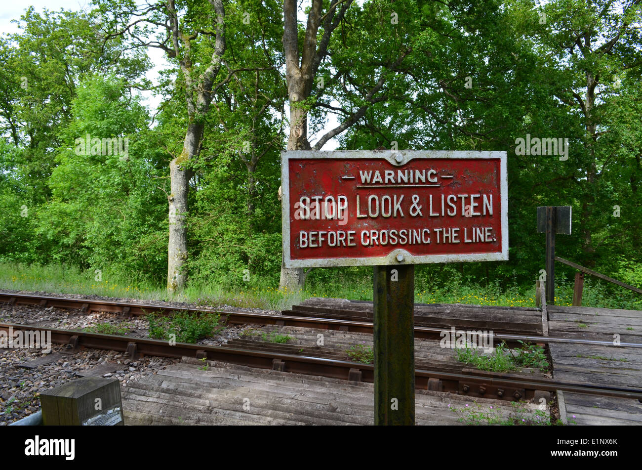 Warning sign on a British rural railway line informing that care should ...