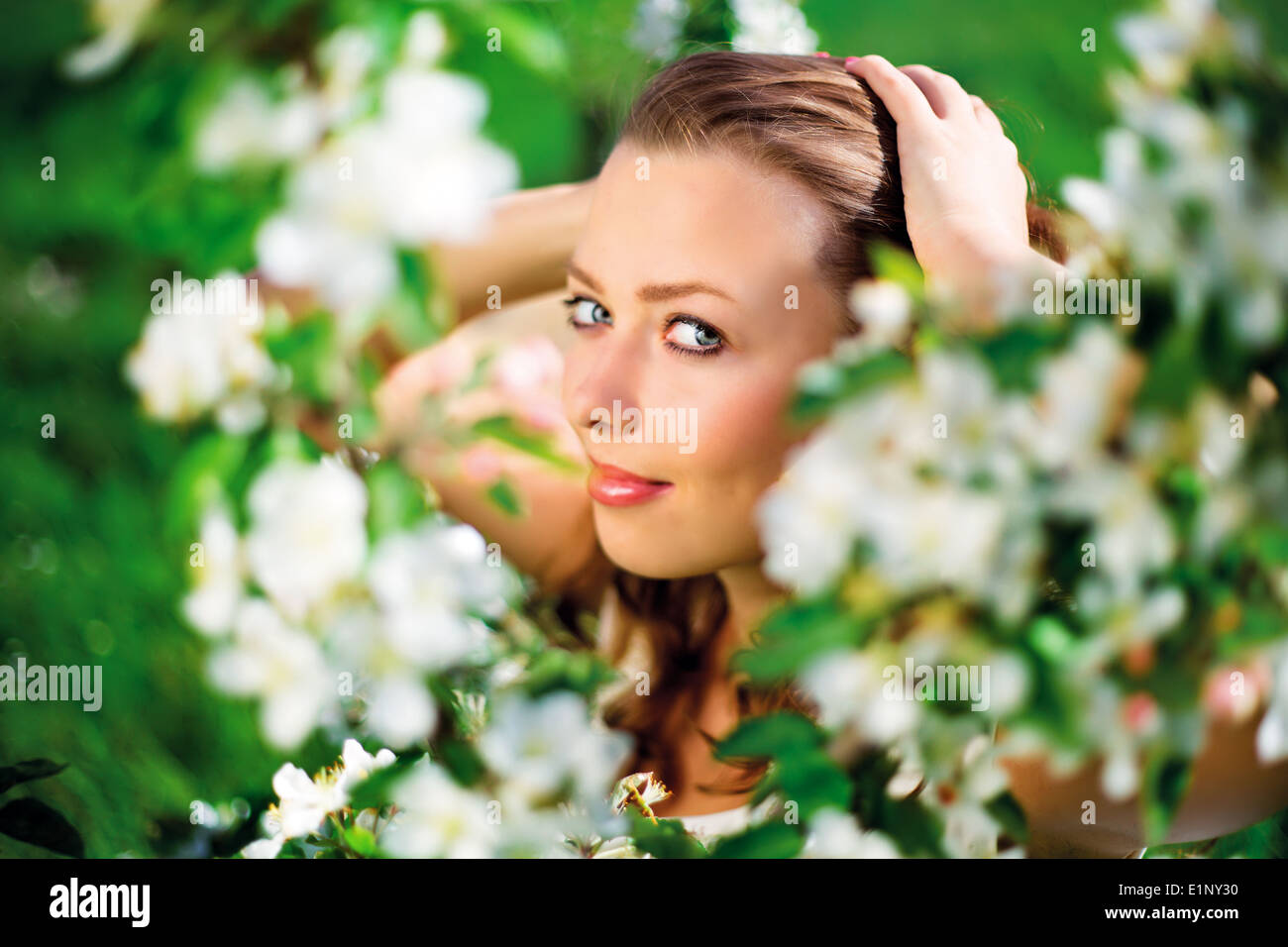beautiful woman with an apple tree outdoors Stock Photo - Alamy