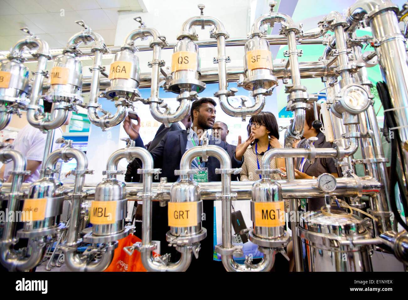 Beijing, China. 8th June, 2014. Visitors view a drinking water ...
