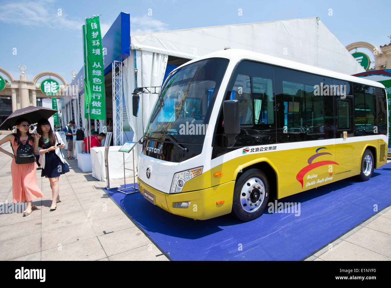 Beijing, China. 8th June, 2014. Visitors view an electric mini bus ...