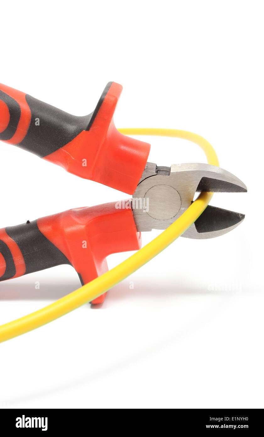 Metal pliers with green-yellow electric cable, pliers cut the cable ...