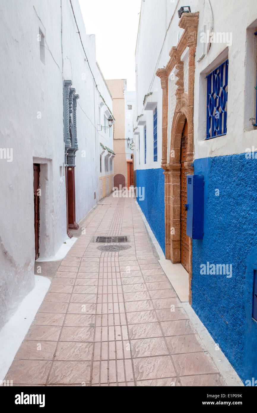 Traditional lime-washed narrow street inside the Medina in Rabat ...