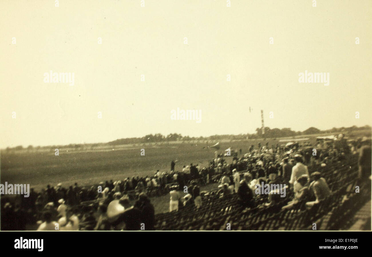 The image depicts an early air race, showcasing the competitive nature ...