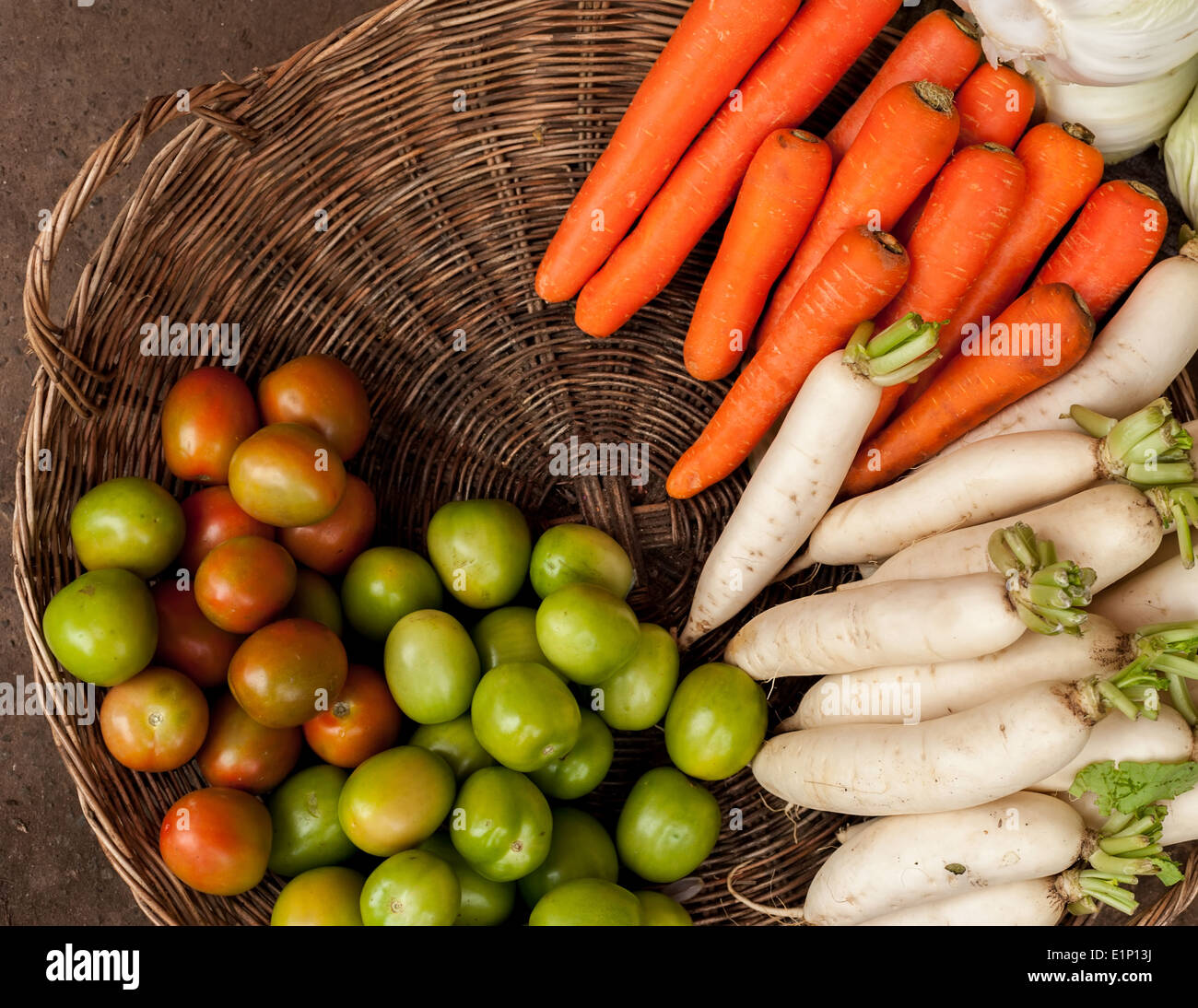 Fresh organic vegetables in wicker baskets at asian market Stock Photo ...