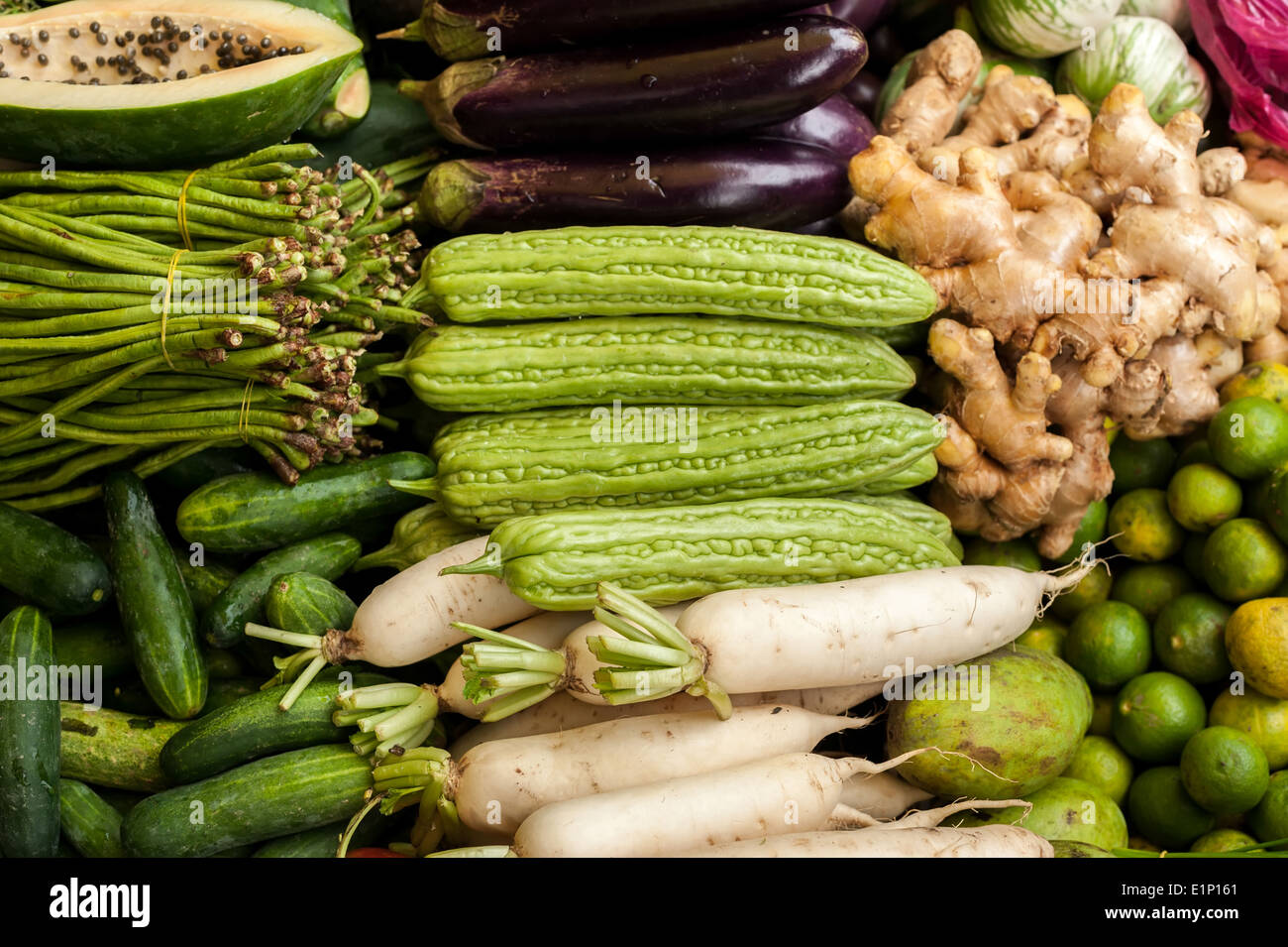 Fresh organic vegetables and herbs at asian market Stock Photo - Alamy