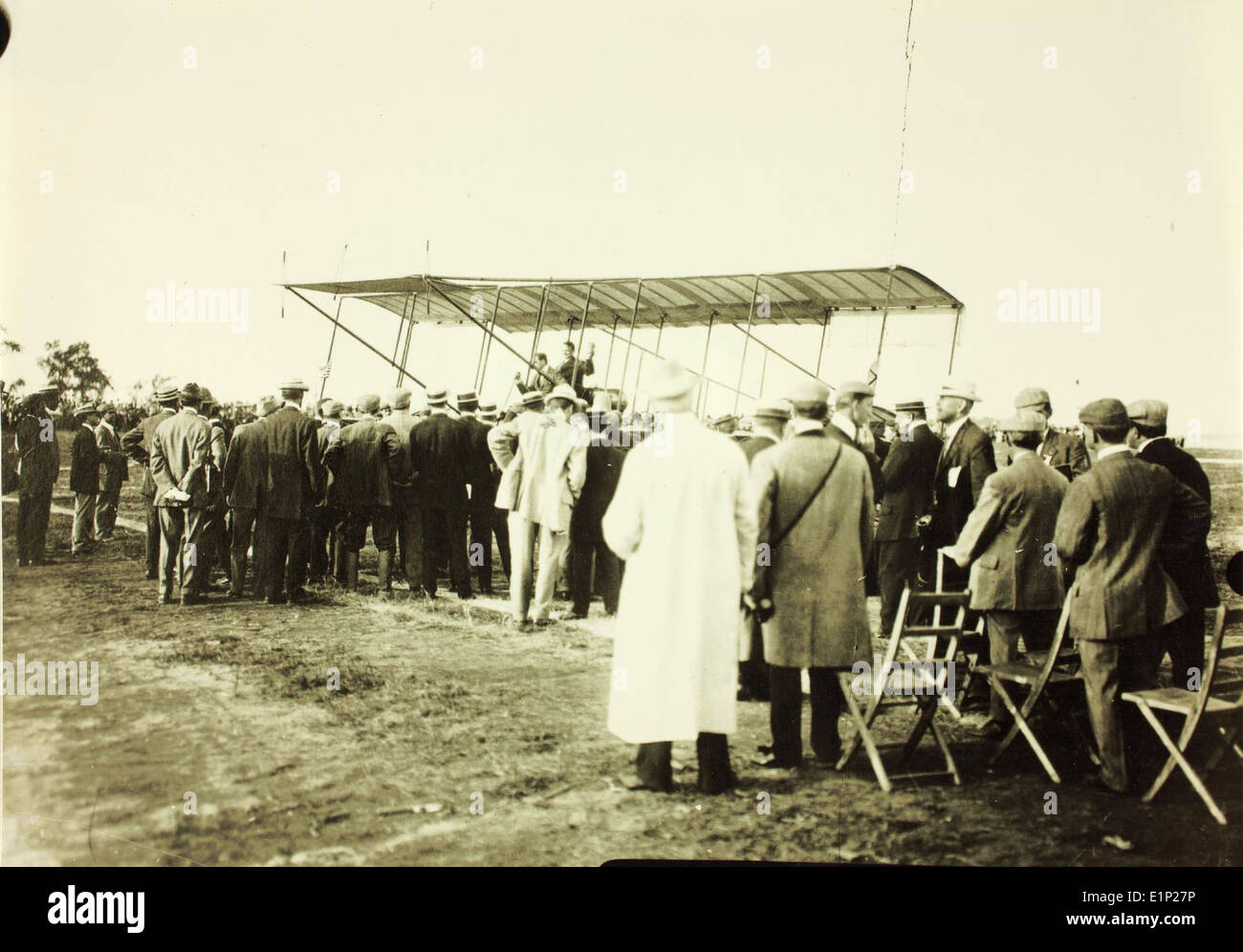 This image captures an air show featuring a Harvard aircraft over ...