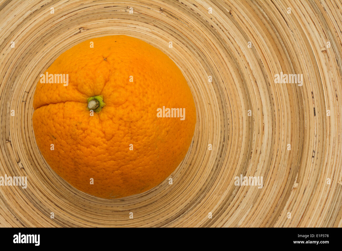 Still Life / Concept / Pattern - an Orange on a patterned wooden bowl ...