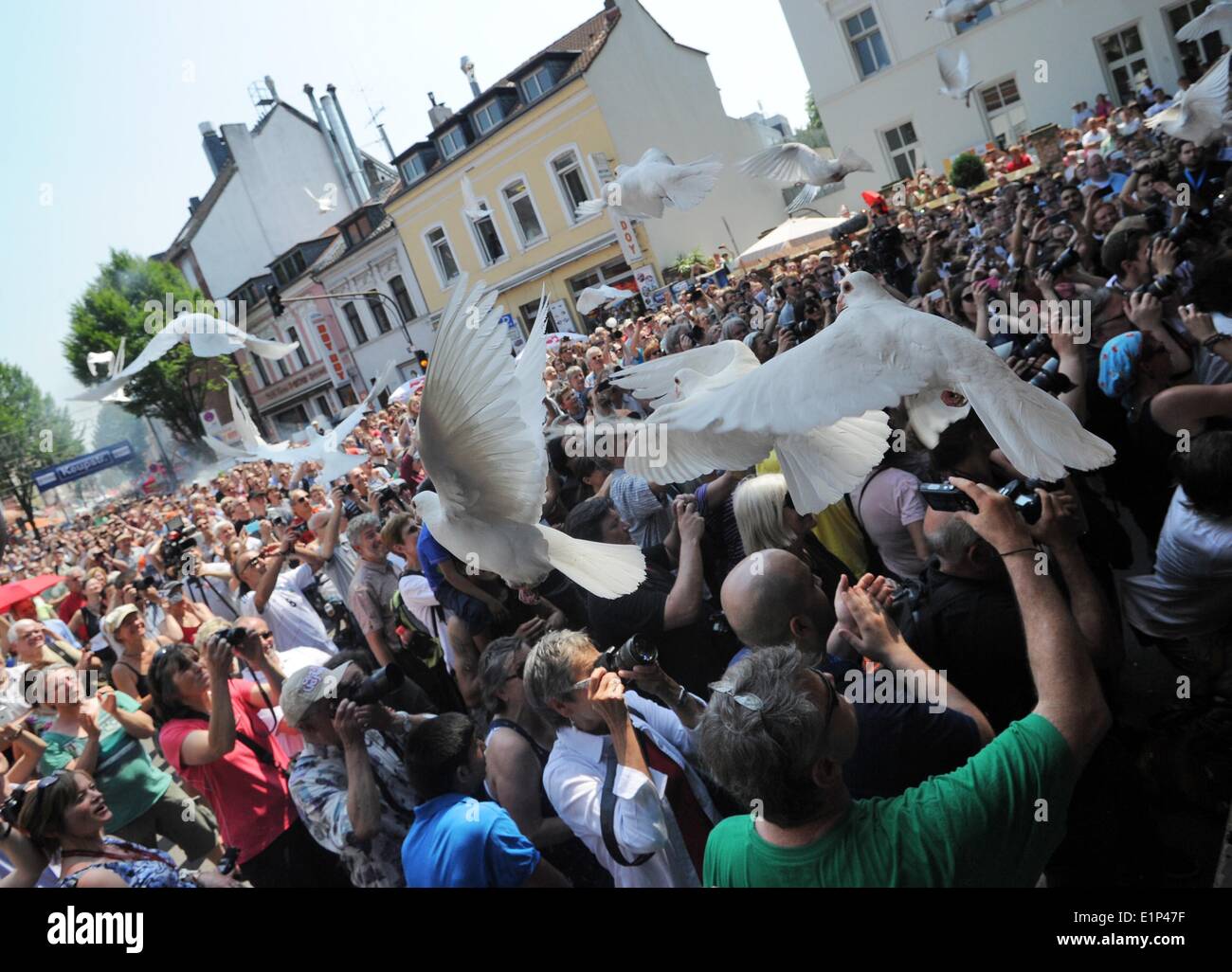 Cologne, Germany. 08th June, 2014. White doves fly as a symbol of peace ...
