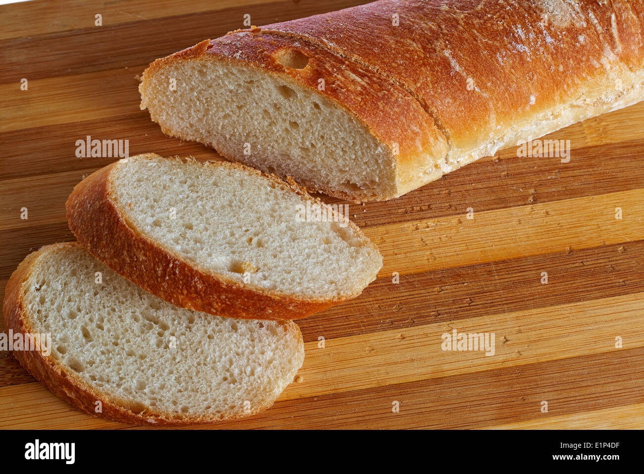loaf of bread on a board grooved Stock Photo - Alamy
