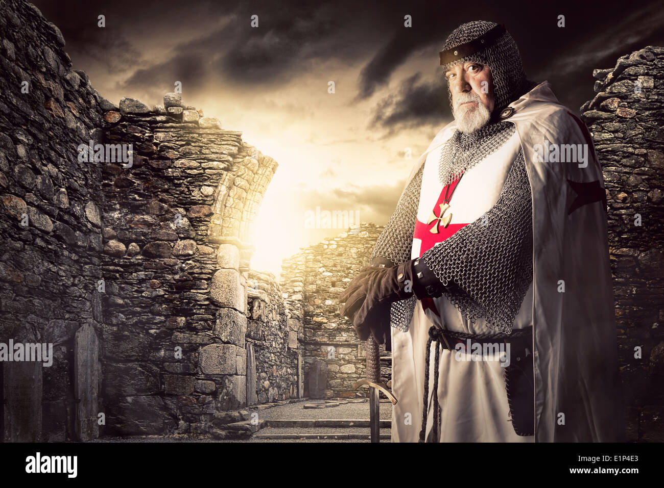 Knight Templar posing near some ruins Stock Photo - Alamy