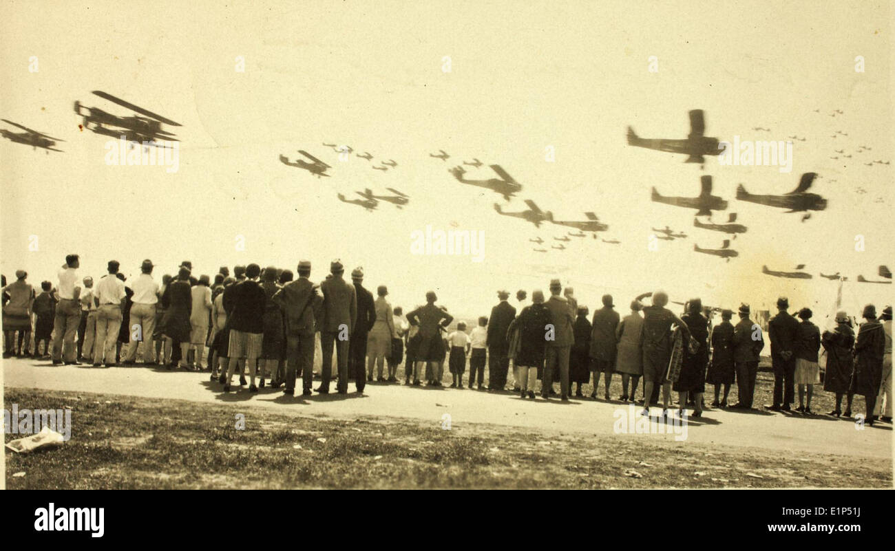 A historic flight formation features multiple aircraft flying in a ...