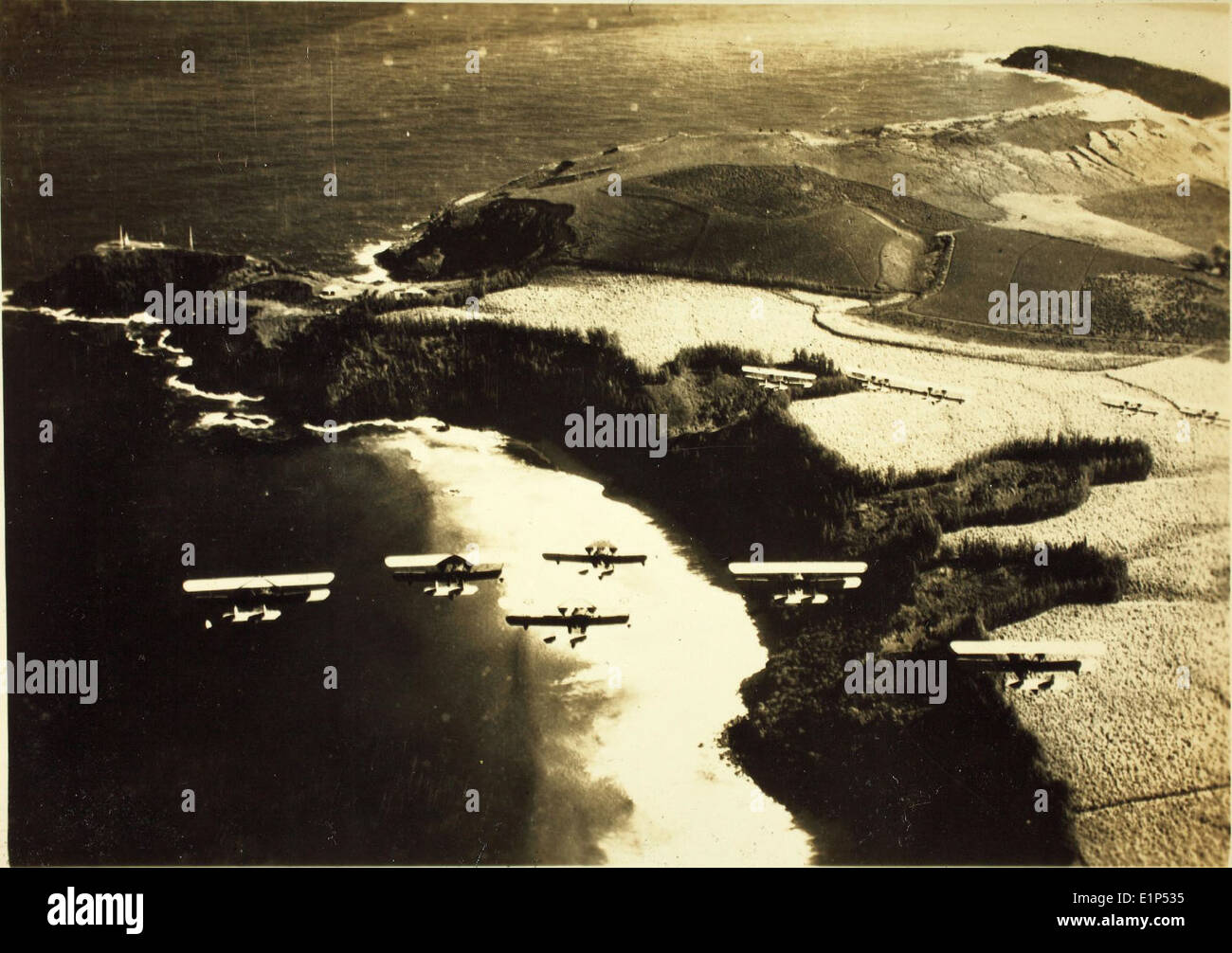 This image shows a historic flight formation, where multiple aircraft ...
